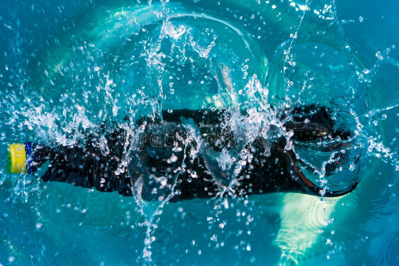 Plastic Bottle Falling into the Water Making Splashes and Spraying ...