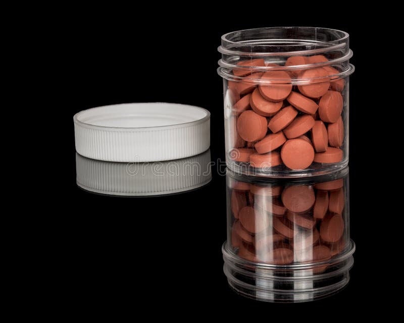 Plastic Bottle Filled with Pills with a White Lid Stock Image - Image ...