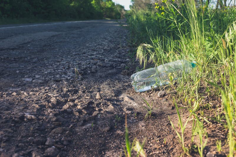 Plastic Bottle with Water by the Road Stock Photo - Image of road ...