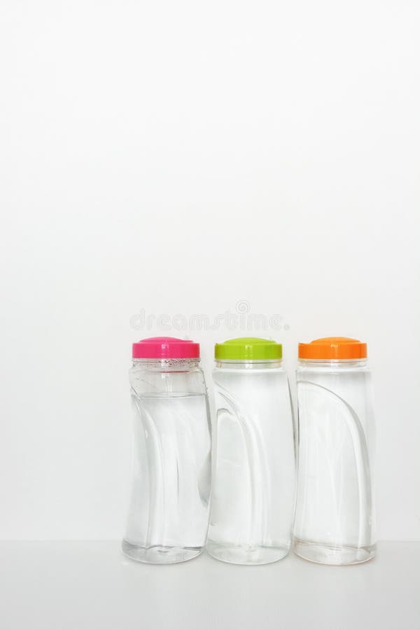 Plastic Bottles of Drinking Water and Glass on White Background Stock ...