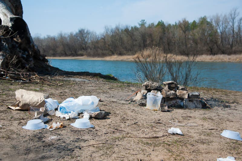 Garbage Waste on the Shore of a River Stock Photo - Image of ...