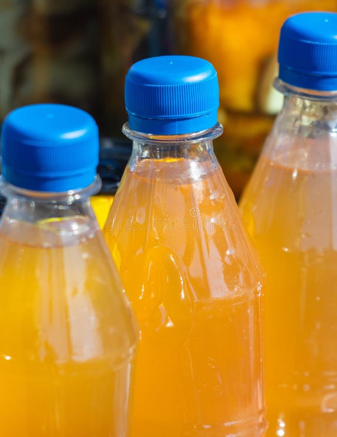 Plastic Bottles of Orange Juice in the Market. Close Up Stock Photo ... Plastic Bottles of Orange Juice in the Market. Close Up Stock Photo ...