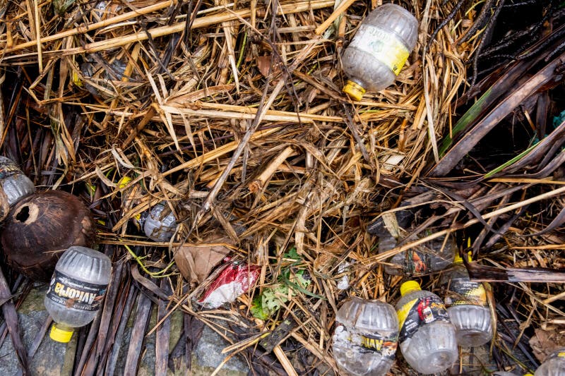Plastic Bottles and Rubbish Dumped on the Banks of a River Editorial ...