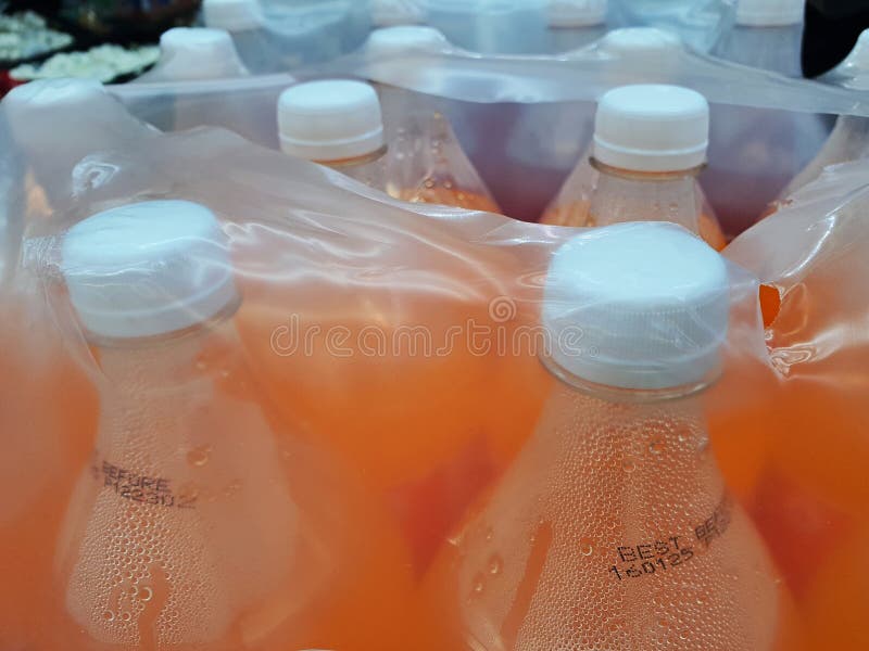 Plastic Bottles of Soft Drinks Stock Photo - Image of orange, soft ...
