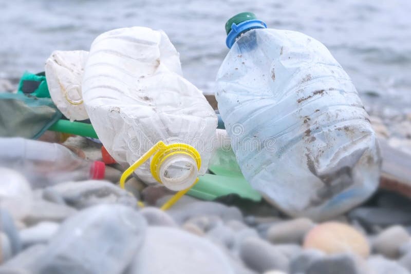 Dirty Plastic Bottles on the Stone Beach. Environmental Pollution ...