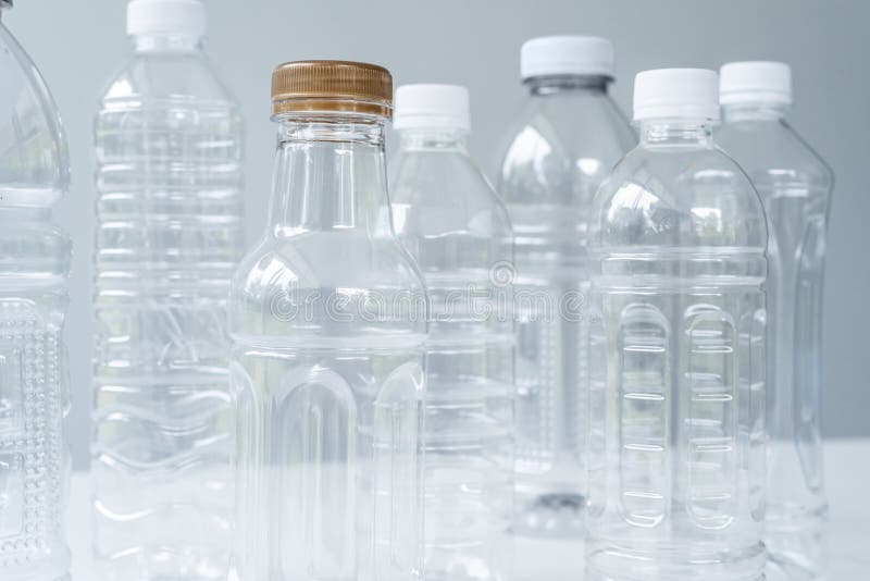 Plastic Bottles in Various Shapes and Sizes on White Table and ...