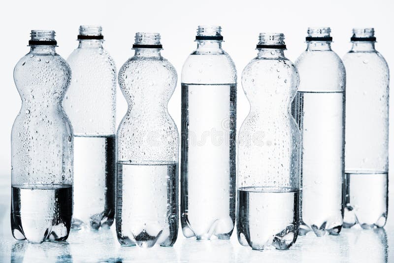 Plastic Bottles of Water in Row Isolated Stock Image - Image of light ...