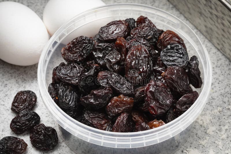 Plastic Bowl with Black Flame Raisins from Chili Close Up Stock Photo ...