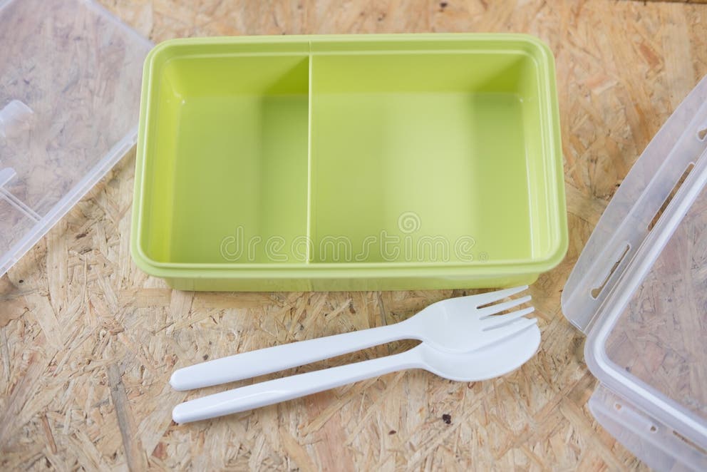 Plastic Box, Fork and Spoon on Wood Table Stock Image - Image of green ...