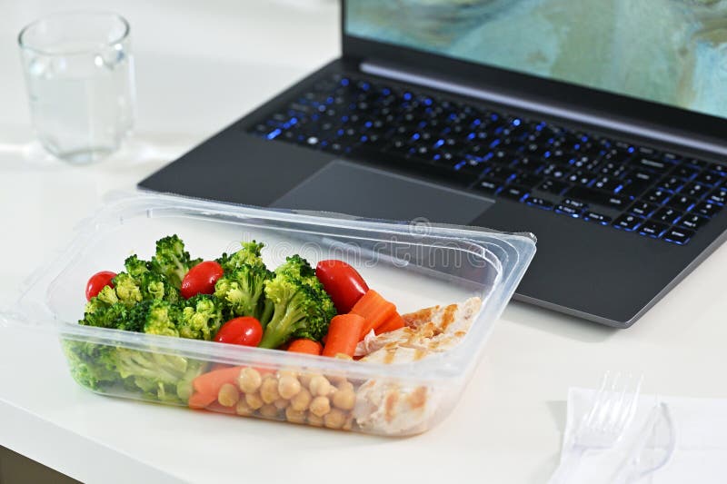 Plastic Box with Lunch in Front of Laptop Stock Image - Image of ...