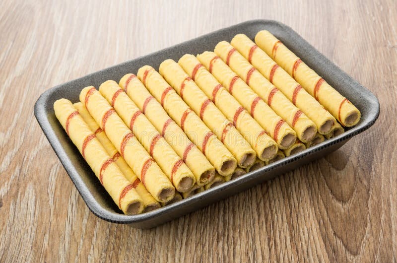 Plastic Box with Wafer Rolls on Table Stock Photo - Image of food ...