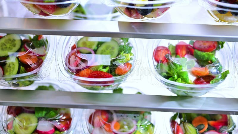 Plastic Boxes with Pre-packaged Fruit and Vegetable Salads in a ...
