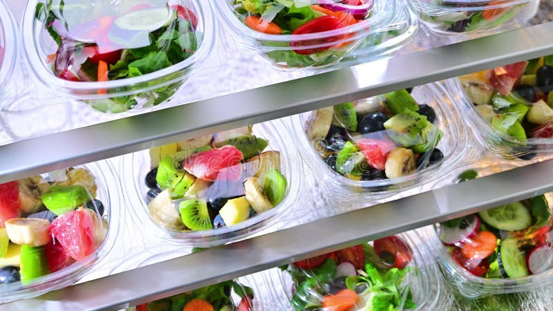 Plastic Boxes with Pre-packaged Fruit and Vegetable Salads in a ...