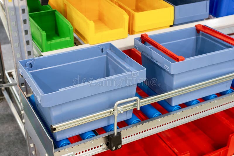 Plastic Boxes on the Roller Conveyor. Stock Photo - Image of metal ...