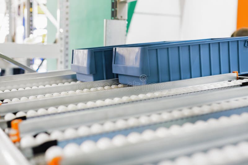 Plastic Boxes on the Roller Conveyor. Stock Image - Image of shelf ...