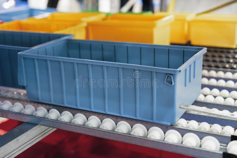 Plastic Boxes on the Roller Conveyor. Stock Photo - Image of ...