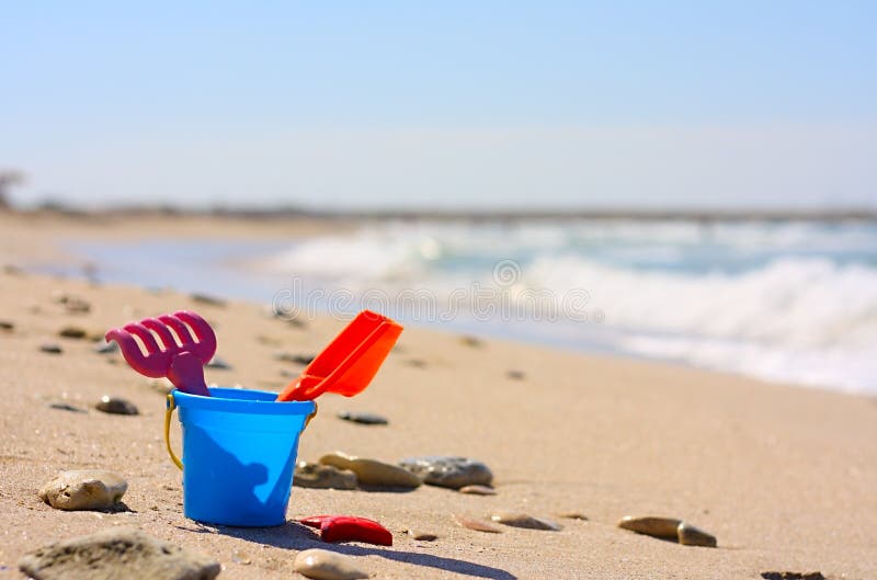 Plastic Bucket on the Beach Stock Photo - Image of coastline, plastic ...