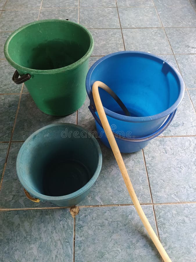 Plastic Buckets in Multiple Colors Placed Together on Tiled Flooring ...