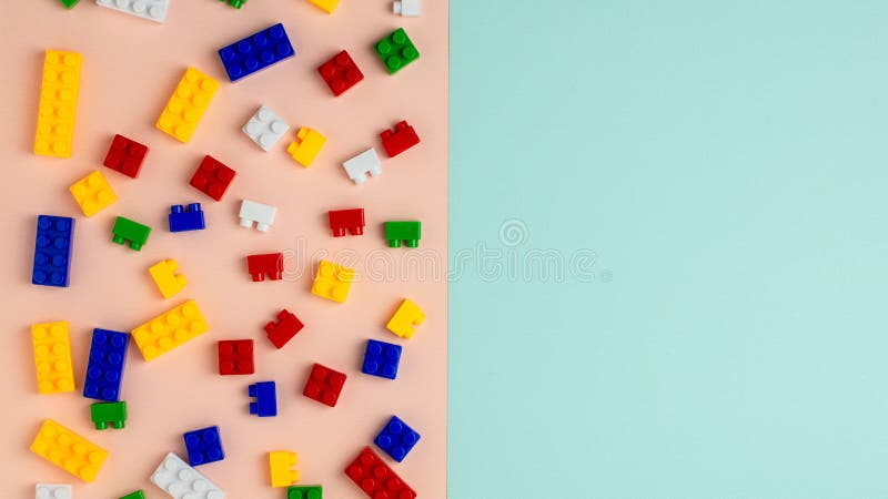 Plastic Building Blocks on Blue and Pink Desk. Stock Photo - Image of ...