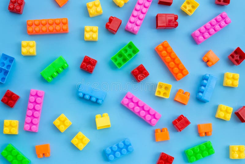 Plastic Building Blocks on Blue Stock Image - Image of block ...