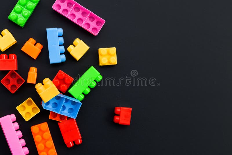 Plastic Building Blocks on Dark Background Stock Image - Image of game ...