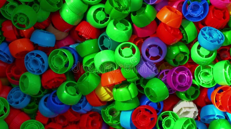 Plastic Caps. Sorting Plastic, Colored Plastic Caps for Recycling Stock ...