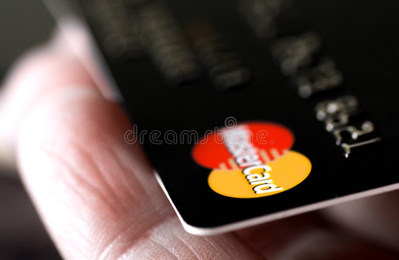 Mastercard in hand editorial stock image. Image of focus - 100165189