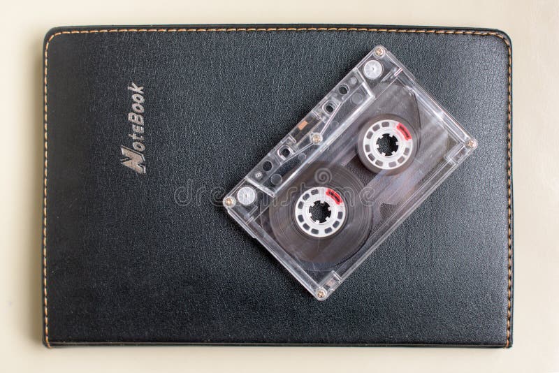 Plastic Cassette on a Black Notebook Stock Photo - Image of compact ...