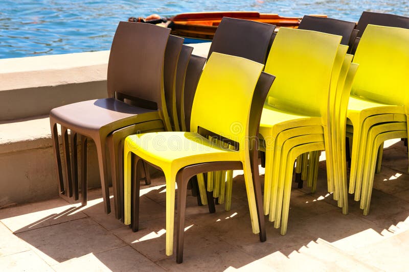 Plastic Chairs Arranged in a Pile Stock Photo - Image of outdoor ...