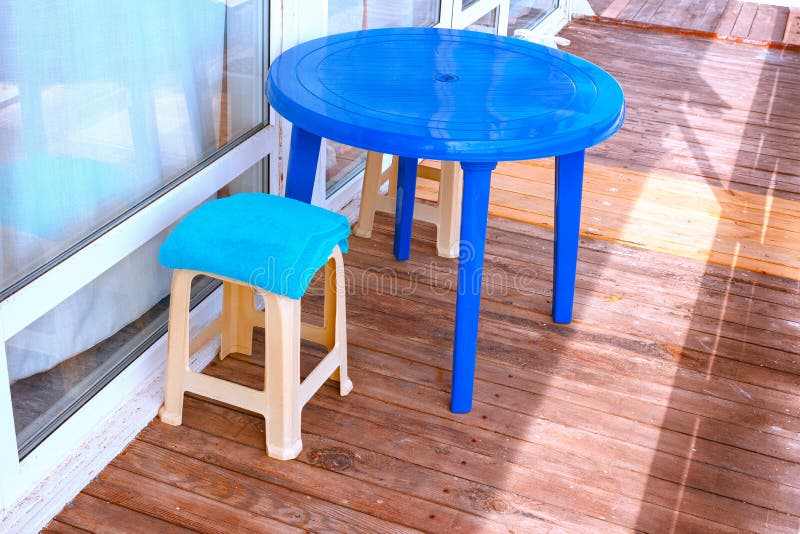 Plastic chairs and table stock image. Image of floor - 254668501