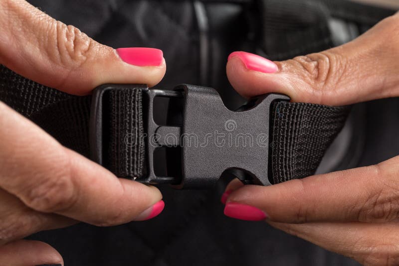 Plastic Clasp for a Backpack in the Hands of a Girl with a Beautiful ...