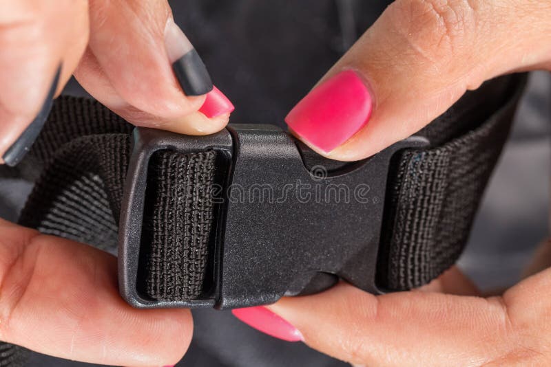 Plastic Clasp for a Backpack in the Hands of a Girl with a Beautiful ...