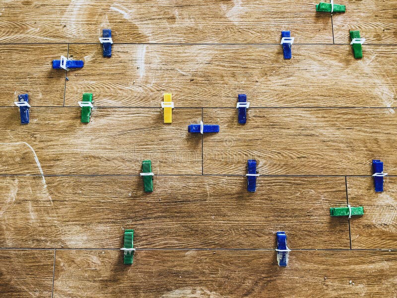 Plastic Clips and Wedges Securing Tiles in Place for Perfect Alignment ...