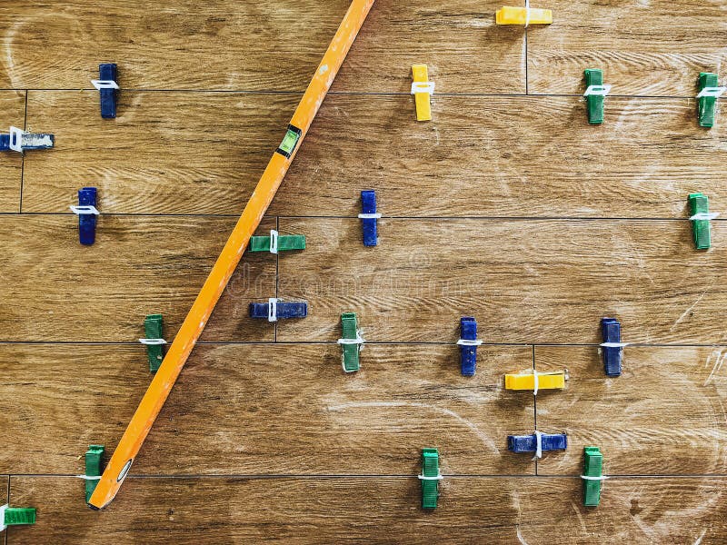 Plastic Clips and Wedges Securing Tiles in Place for Perfect Alignment ...