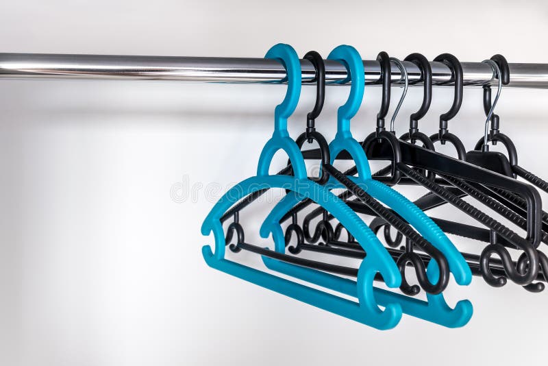 Plastic Clothes Hangers Hanging on a Metal Rod Stock Photo - Image of ...