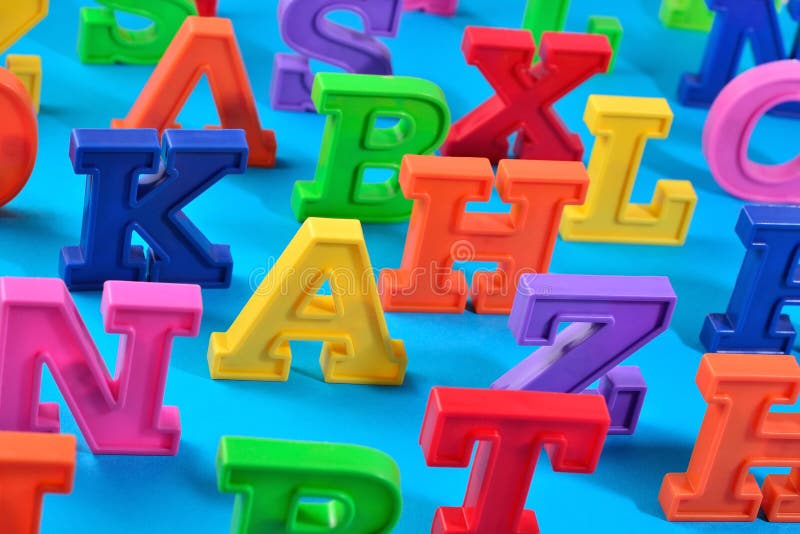 Plastic Colorful Alphabet Letters Close Up on a Blue Stock Image ...