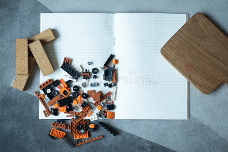 Plastic Construction Bricks on Empty Paper Notebook Stock Photo - Image ...
