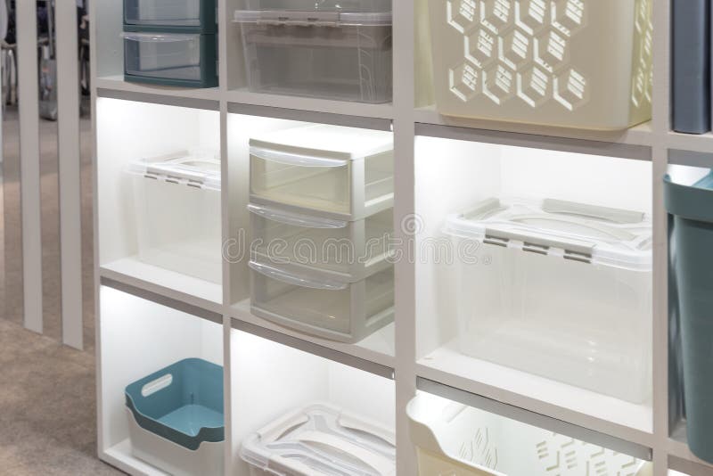 Plastic Container Boxes on a Shelf on a Rack for Organizing Home Space ...