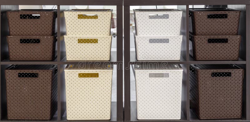 Plastic Container Boxes on a Shelf on a Rack for Organizing Home Space ...