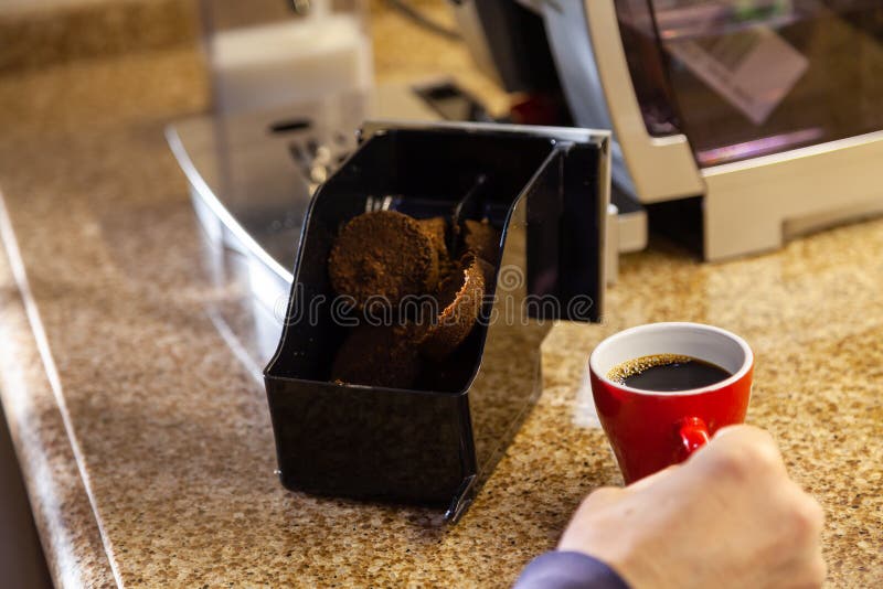 Container for Grounds after Coffee Machine and Cup of Coffee Stock ...