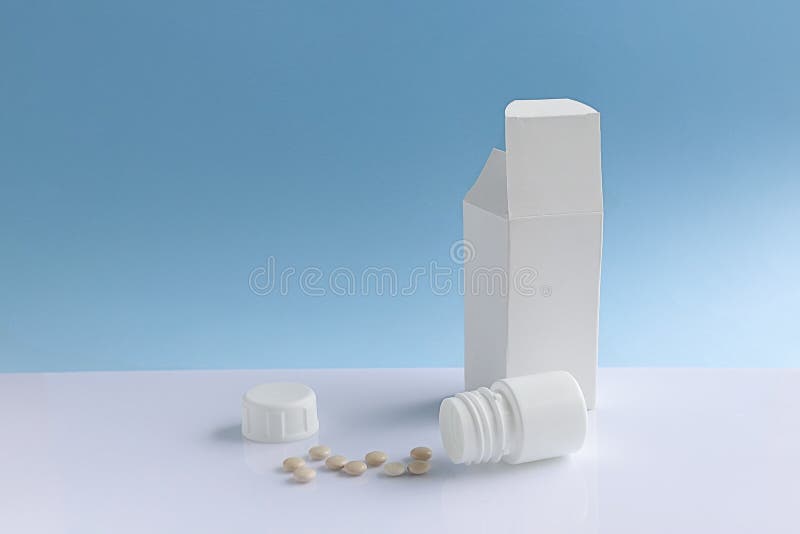 Packaging from Medication and Tablets Scattered on White Surface, Blue ...