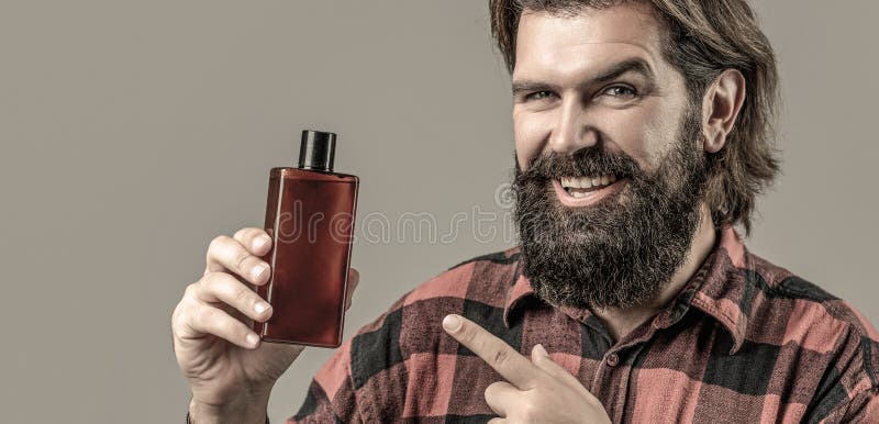 Plastic Container with Shampoo. Young Handsome Man Applying Cream ...