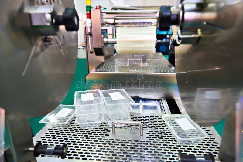 Plastic Containers on Conveyor at Food Factory for Packing Stock Photo ...