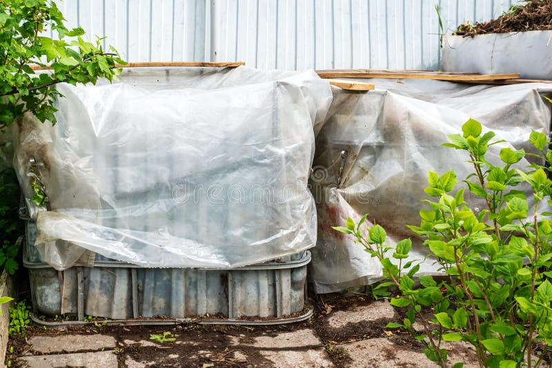 Plastic Containers are Reused for Composting Waste in the Garden. Fresh ...