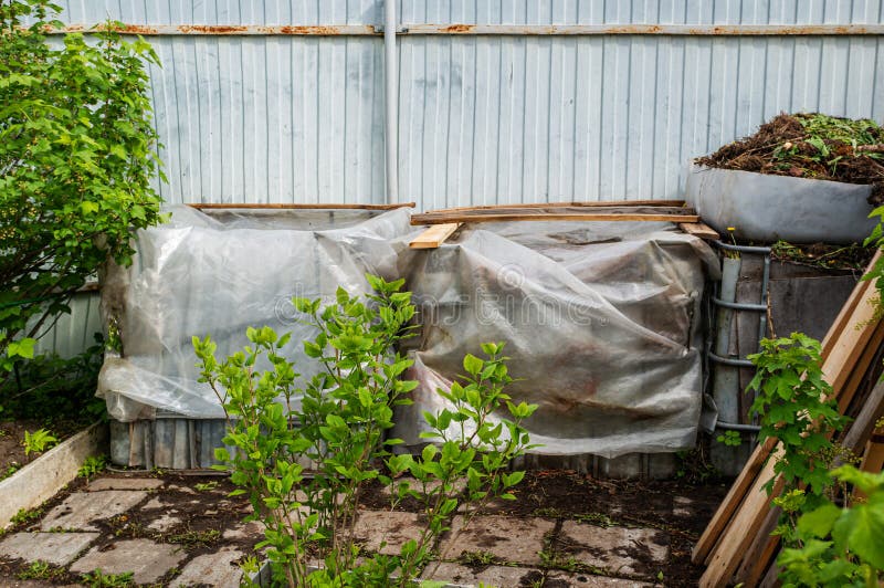 Plastic Containers are Reused for Composting Waste in the Garden. Fresh ...