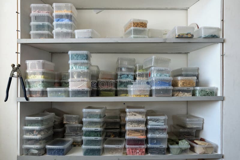 Plastic Containers with Smalt on Shelves in Closet. Regular or ...