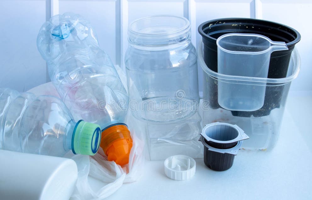 Plastic Containers on a White Background. the Processing of Plastics ...