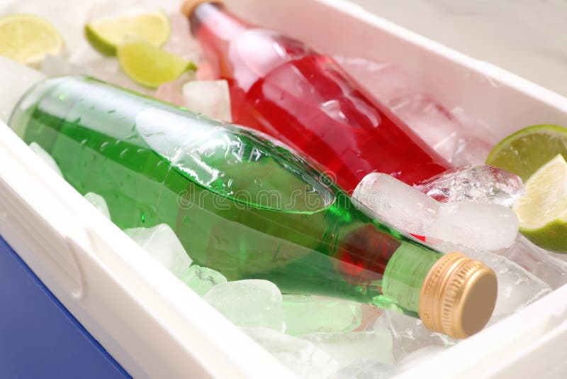 Plastic Cool Box with Ice Cubes and Refreshing Drinks, Closeup Stock ...
