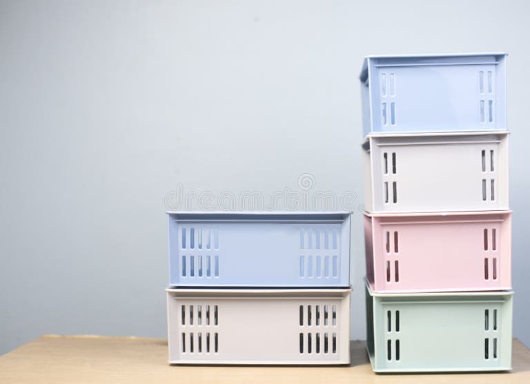 Plastic Crate Containing Items, Assorted Colors, Placed on a Light ...