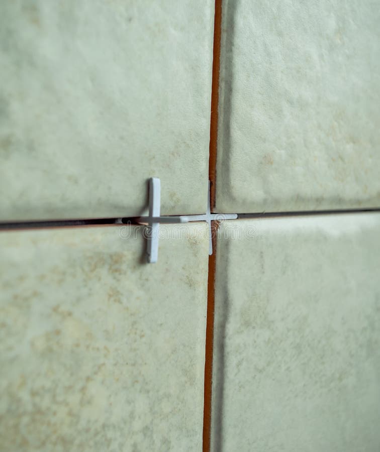 Plastic Cross. Leveling Tiles. Floor Tile Repair. Stock Photo - Image ...